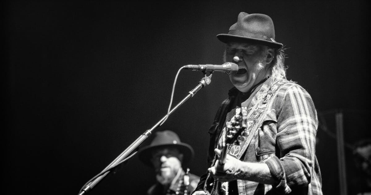 Watch Now: Neil Young Plays "Heart of Gold" and "Comes A Time" at First ...